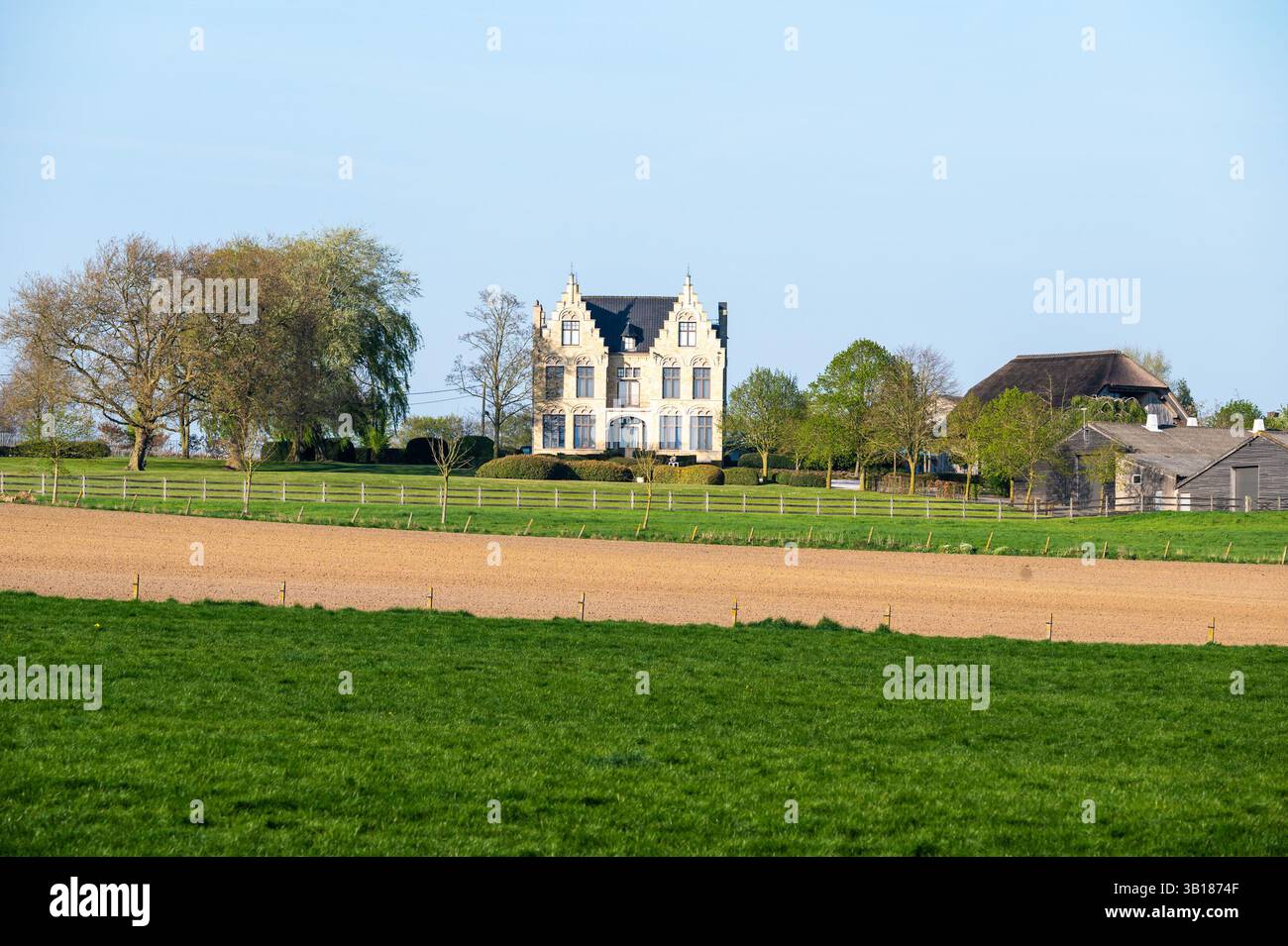 Colorful farmland with monumental castle in Hollebeke, Ieper, West ...