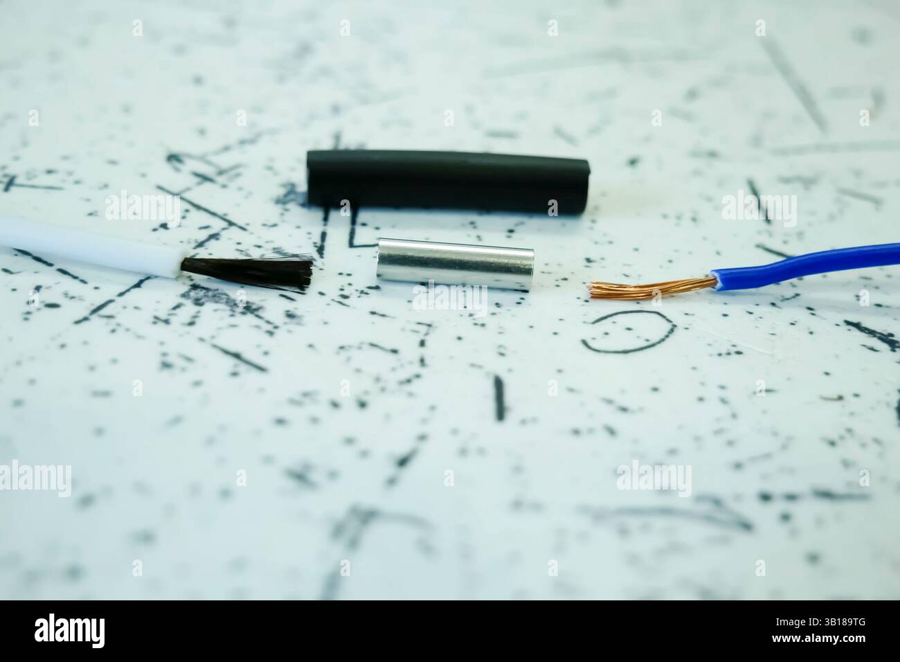 Stripping the ends of wires and connecting them Stock Photo - Alamy