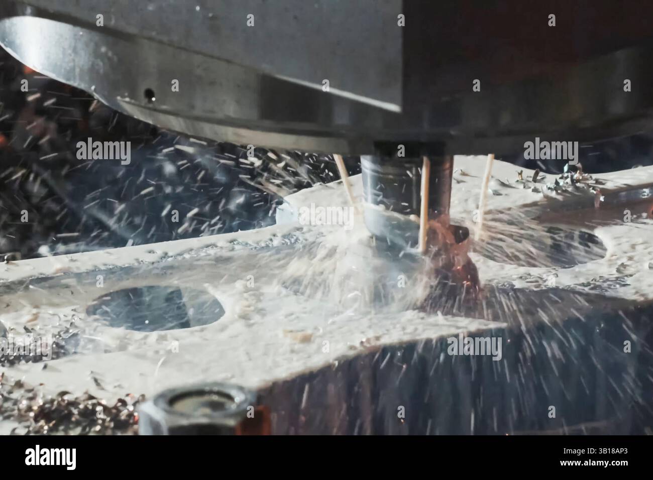 drilling metal with cooling of the drill with liquid Stock Photo - Alamy