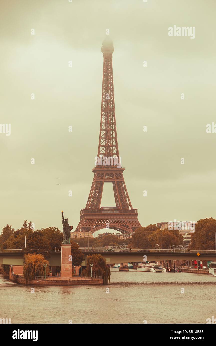 View of the Eiffel Tower and the Statue of Liberty replica on the Île aux Cygnes along the Seine ...