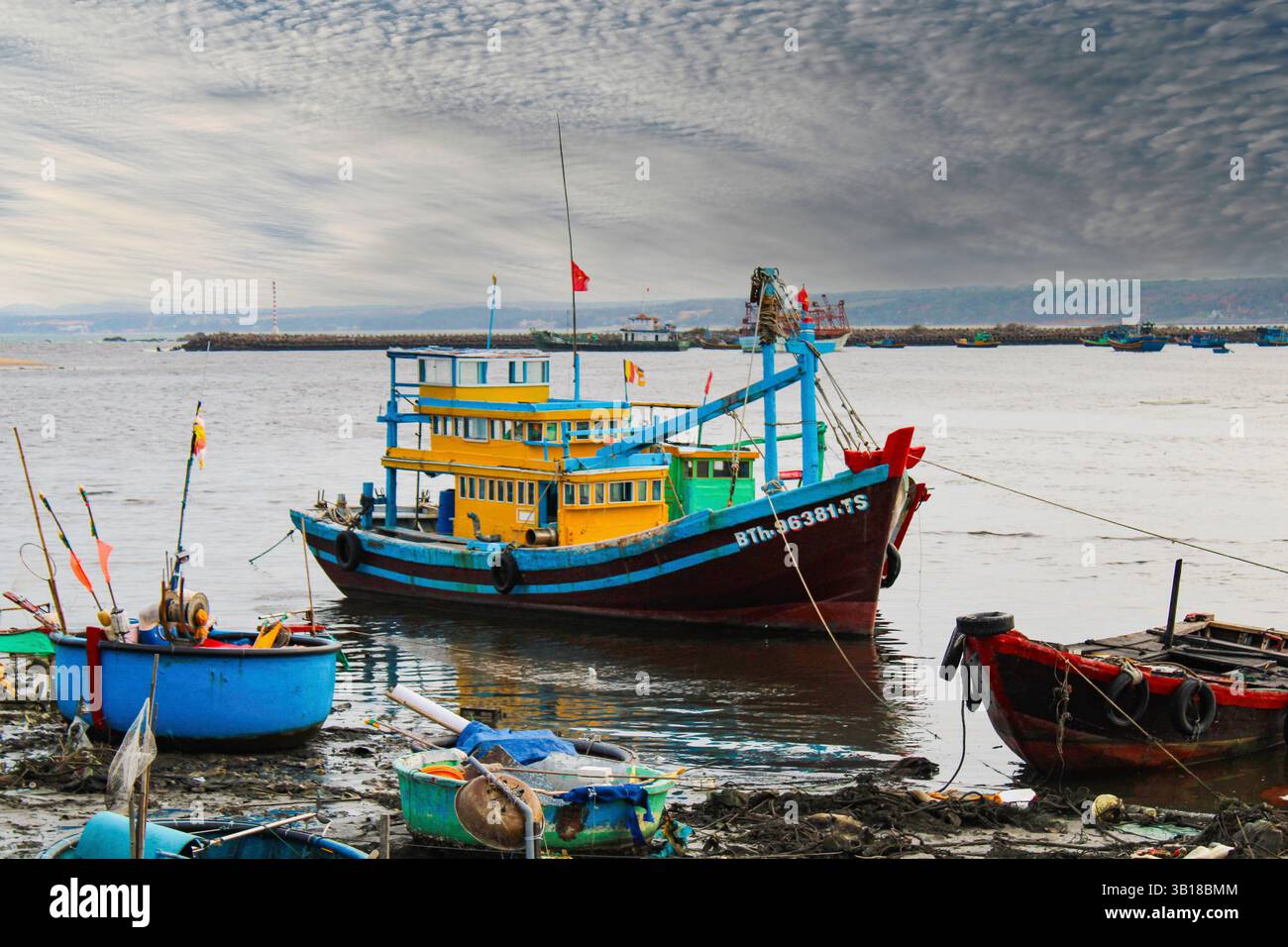 Phan Thiet, Vietnam. Colorful fishing boats in the harbor and ...