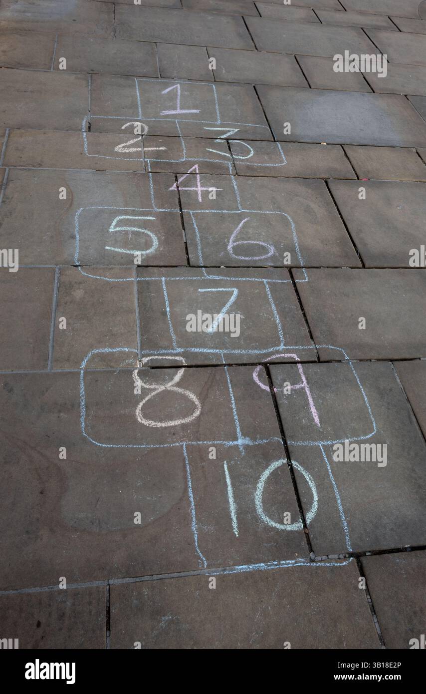 Hopscotch numbers on a pavement Stock Photo - Alamy