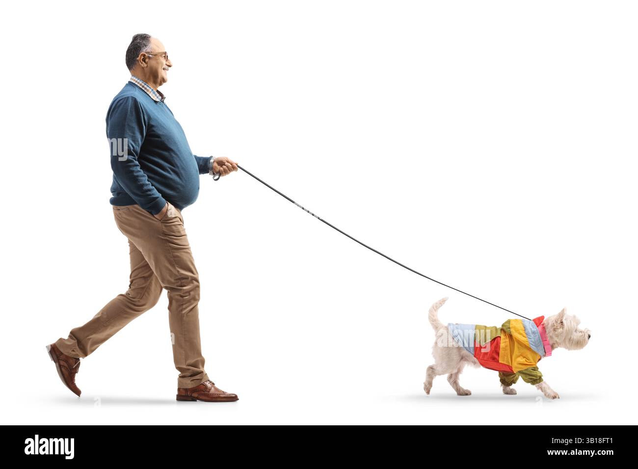 Full length profile shot of a mature man walking a dog dressed with a ...