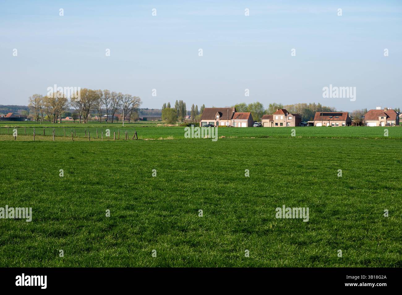 Green agriculture fields and houses in Hollebeke, Ieper, West Flanders ...