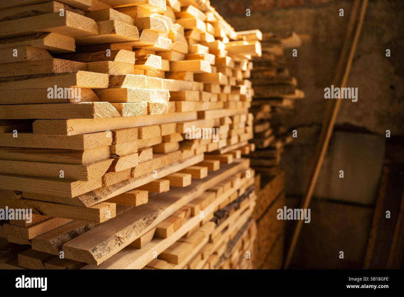 Dry wooden planks stacked inside workshop Stock Photo - Alamy