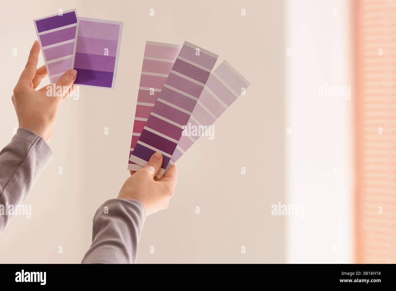 Female hands with violet paint palette swatches at home, closeup Stock ...