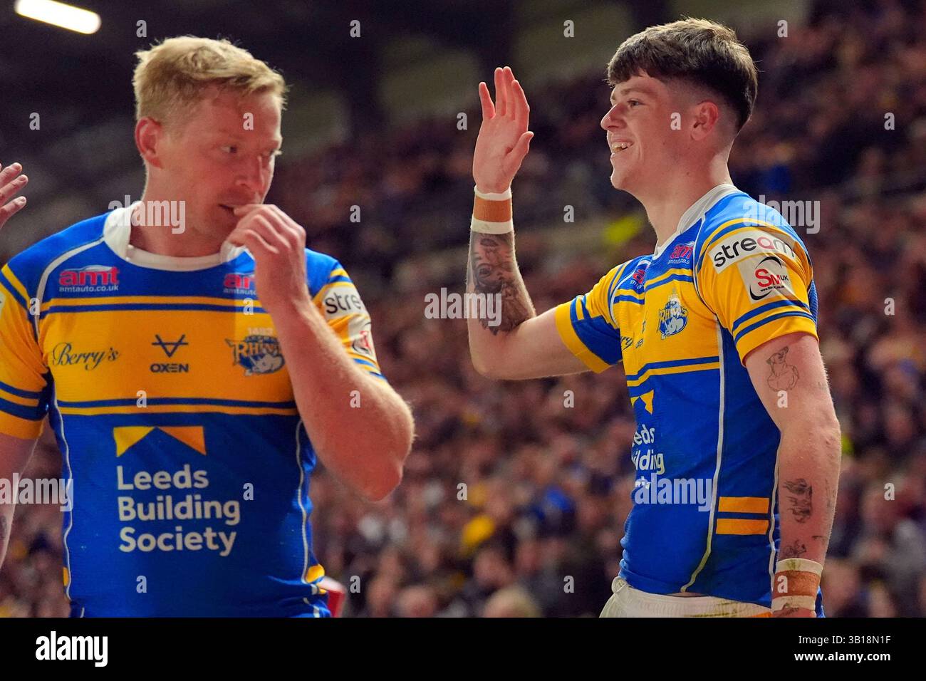 Leeds Rhinos' Riley Lumb (right) celebrates scoring his side's second ...
