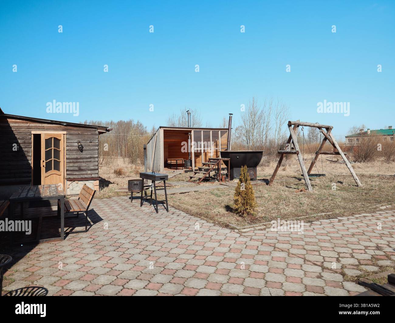 A Charming Outdoor Space Featuring Rustic Structures and a Clear ...