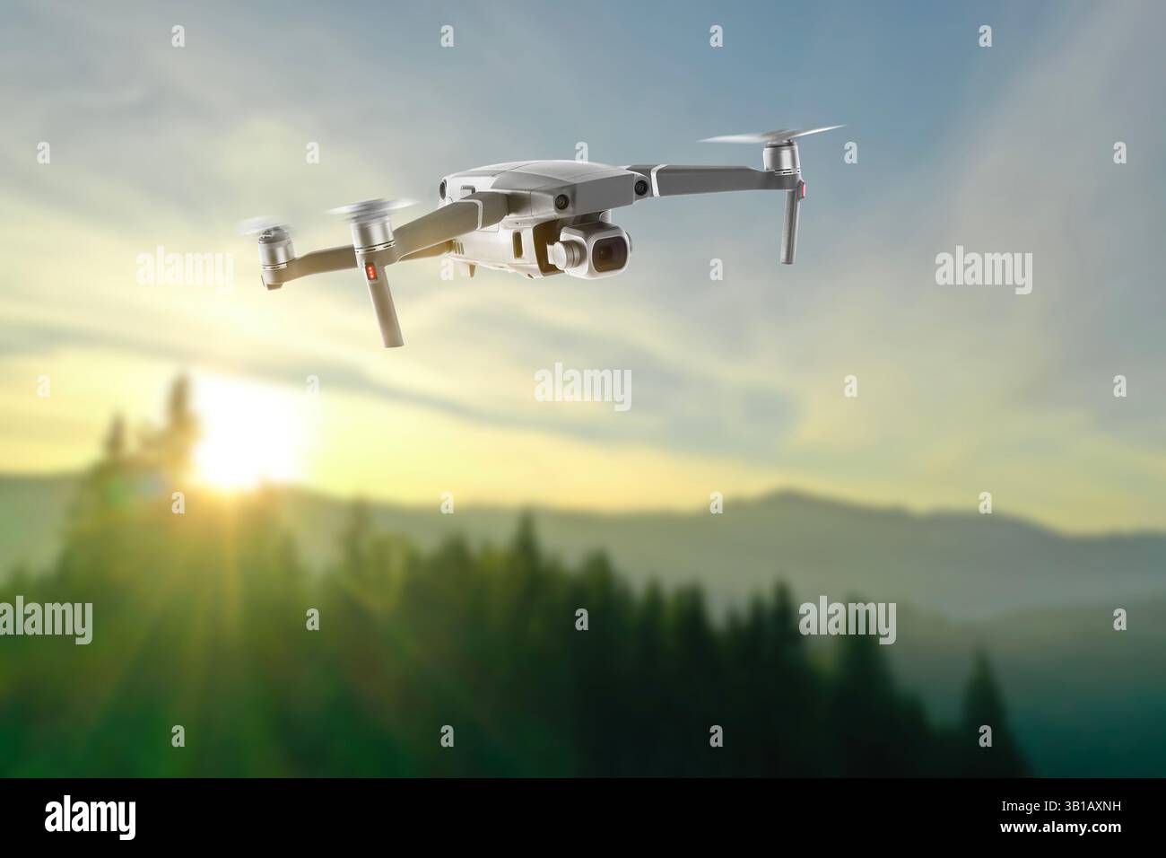 Drone with camera flying in mountains. Unmanned aerial vehicle for ...