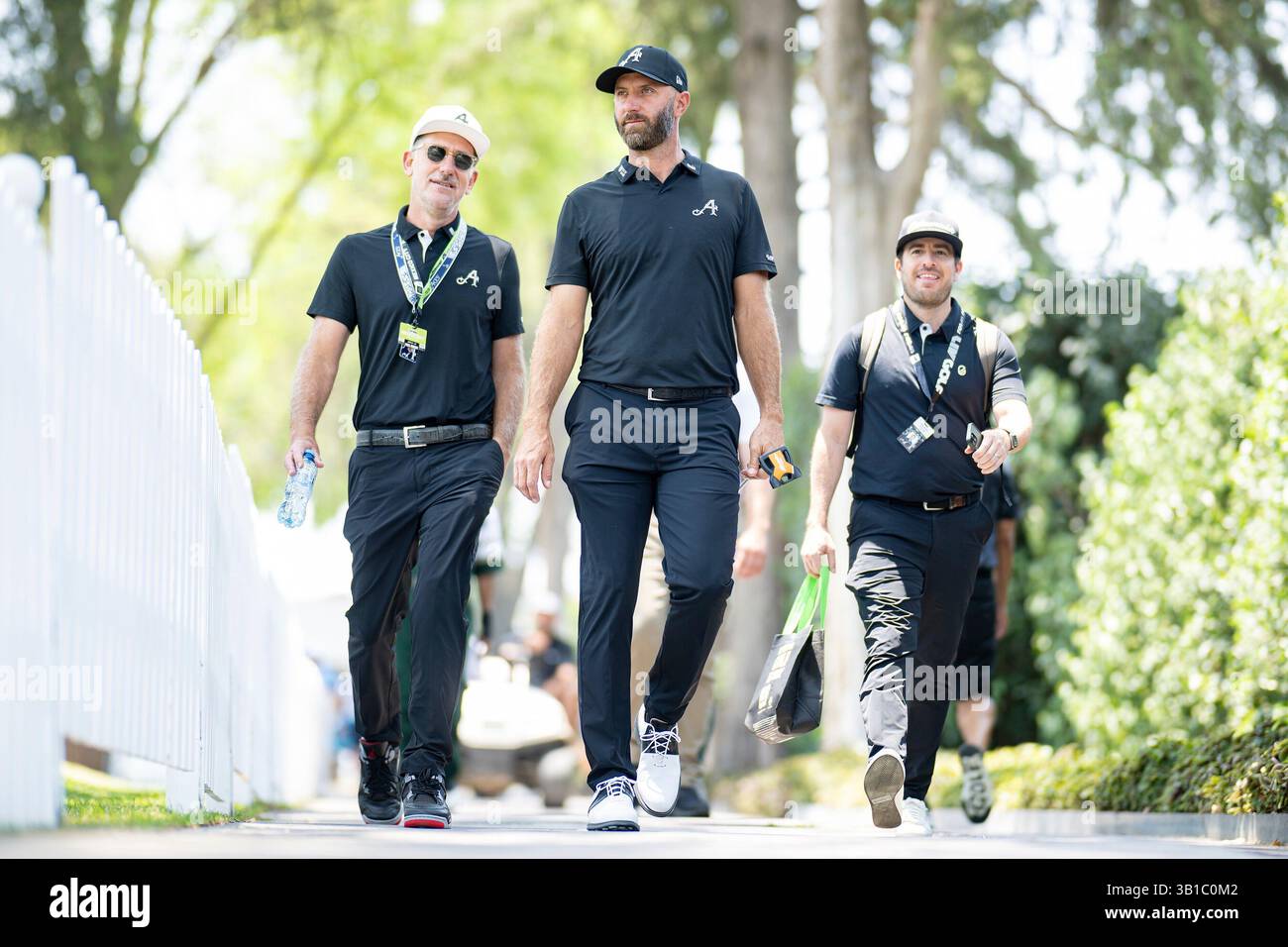 Captain Dustin Johnson of 4Aces GC walks to the driving range before ...