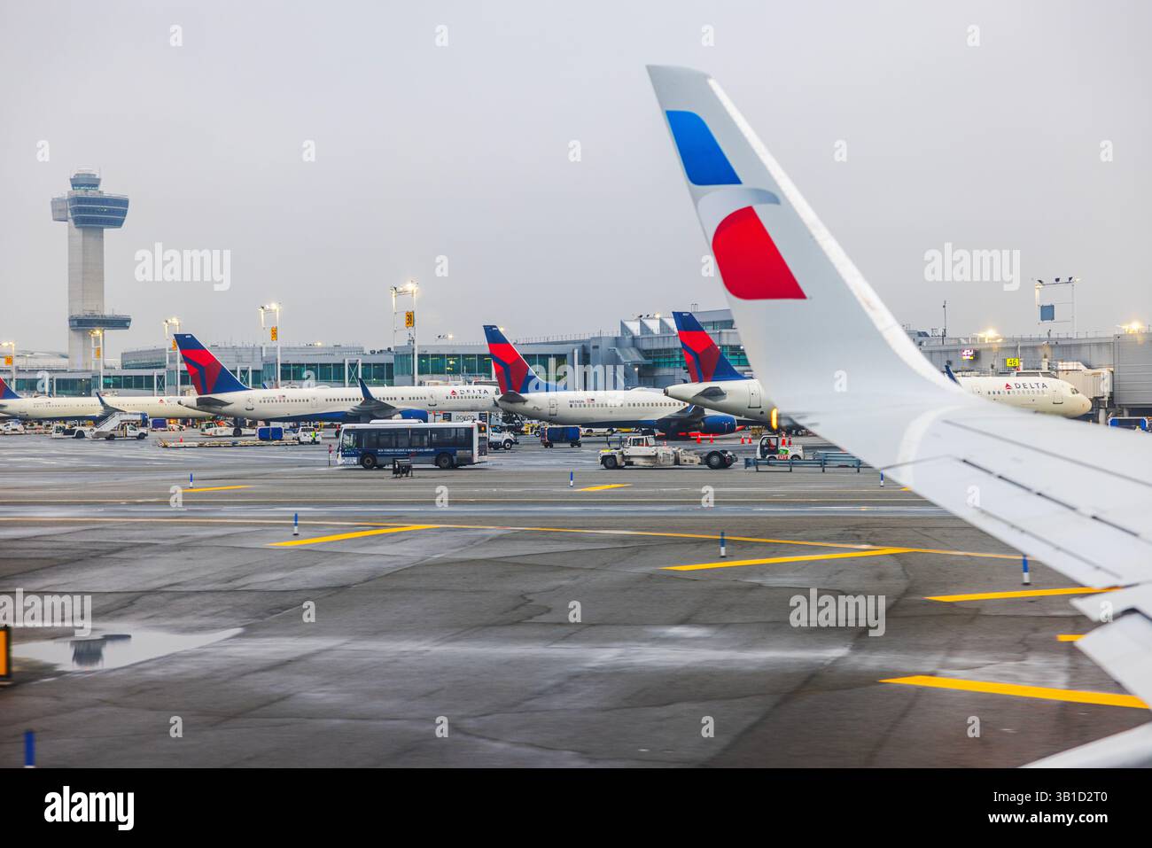 View of airport apron at JFK with Delta and American Airlines aircraft ...