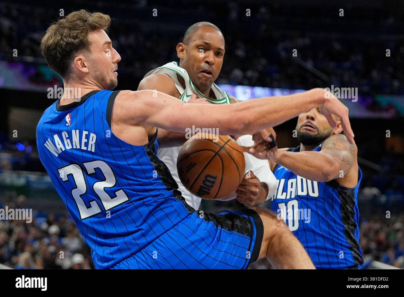 Boston Celtics center Al Horford, center, goes after a loose ball ...