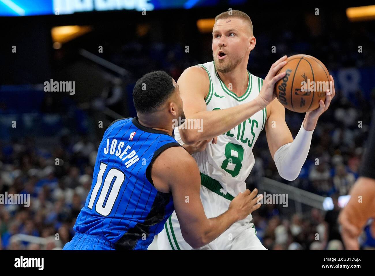 Boston Celtics center Kristaps Porzingis (8) looks for a shot against ...