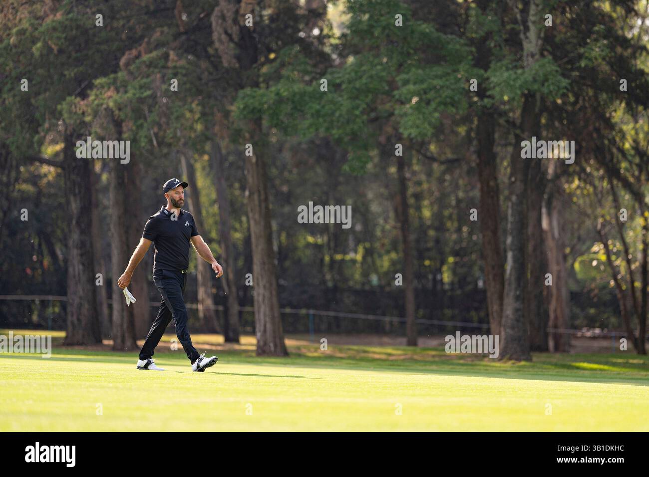 Captain Dustin Johnson of 4Aces GC walks along the fifth hole during ...
