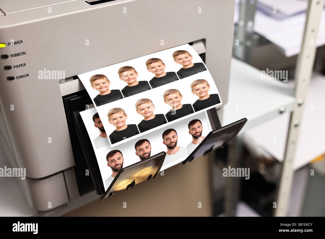 Modern printer with passport photos of man and child indoors, closeup ...