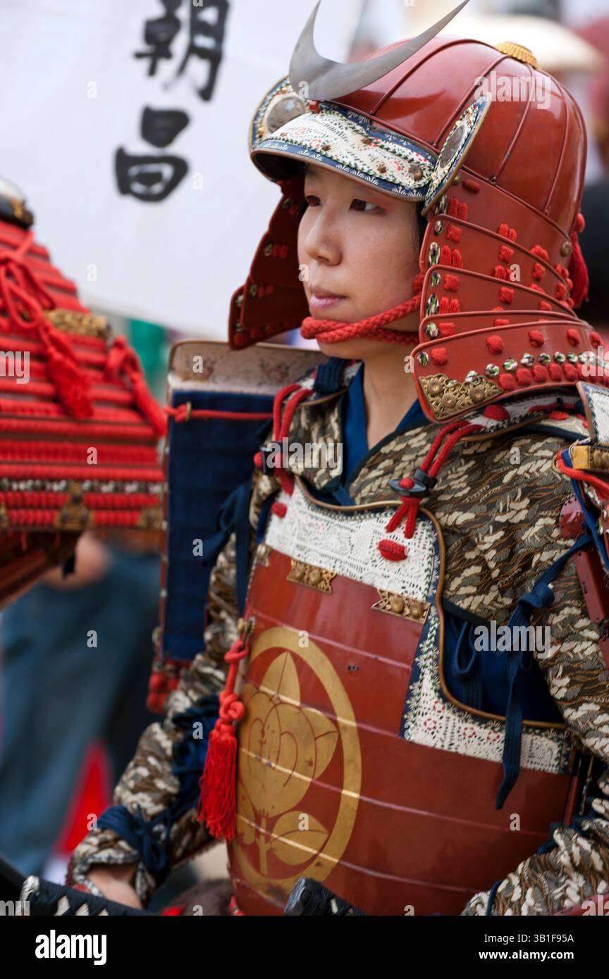 Woman in samurai armor costume with kabuto helmet participates in the ...