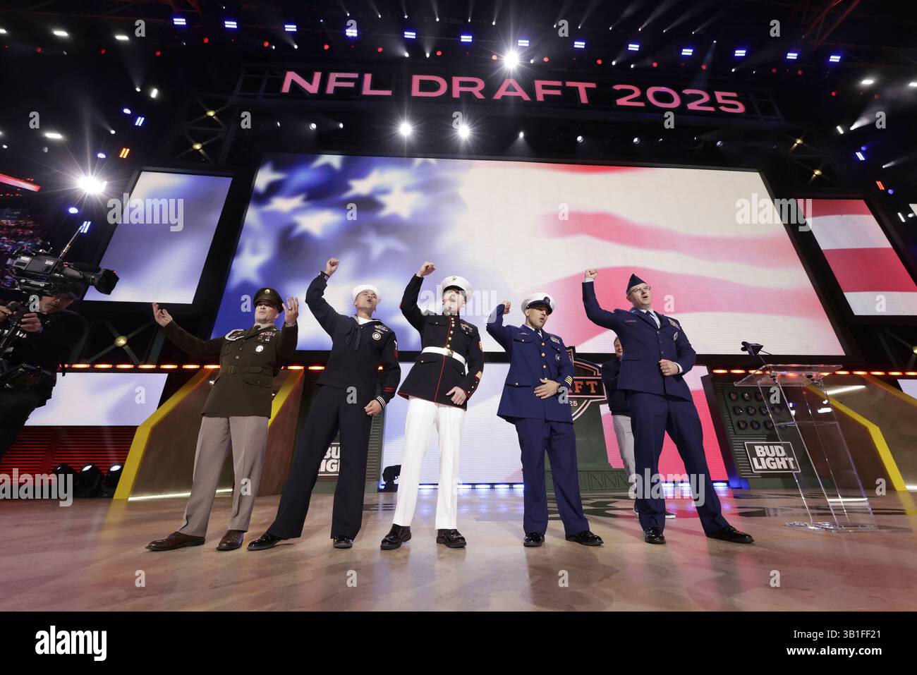 Members of the U.S. military are seen on stage during a military ...