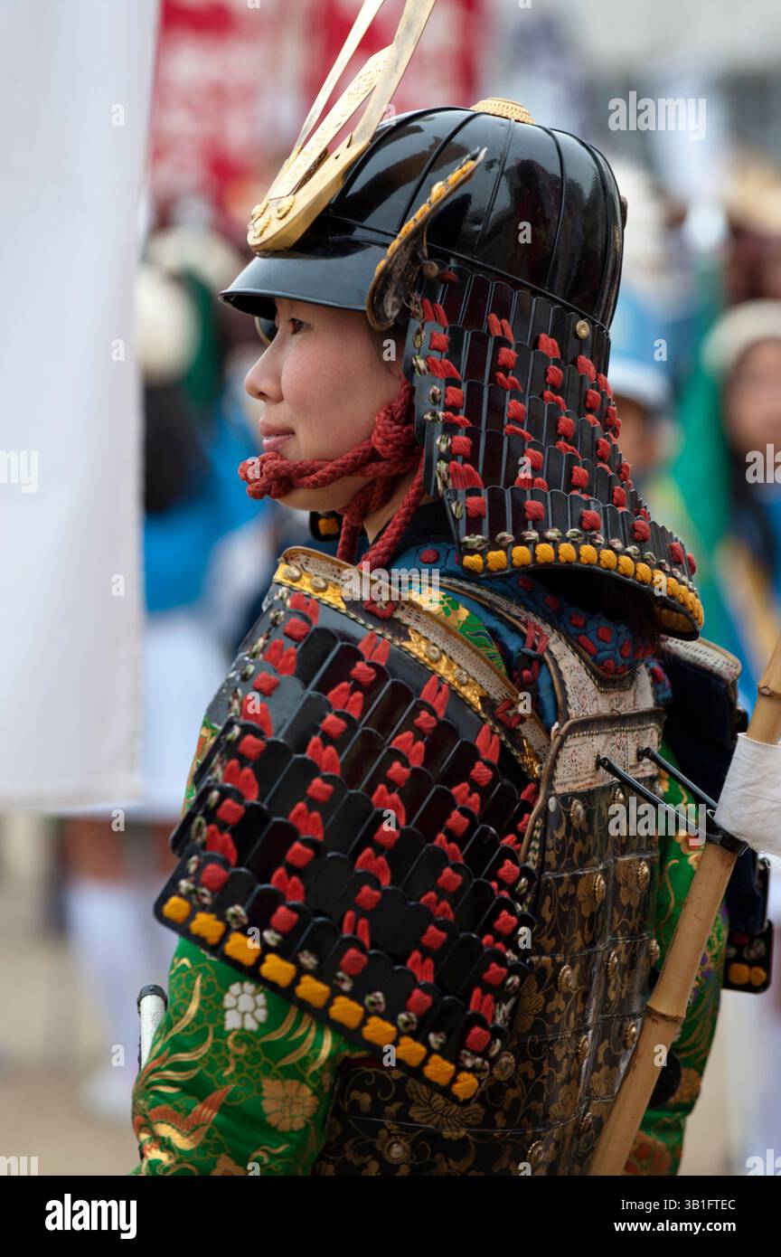Woman in samurai armor costume with kabuto helmet participates in the ...