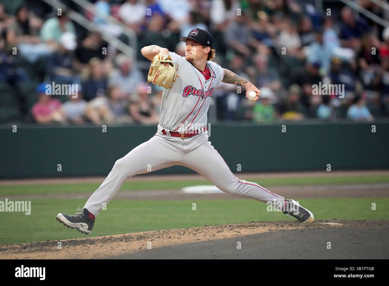 Starting pitcher Noah Dean (29) of the Greenville Drive delivers a ...