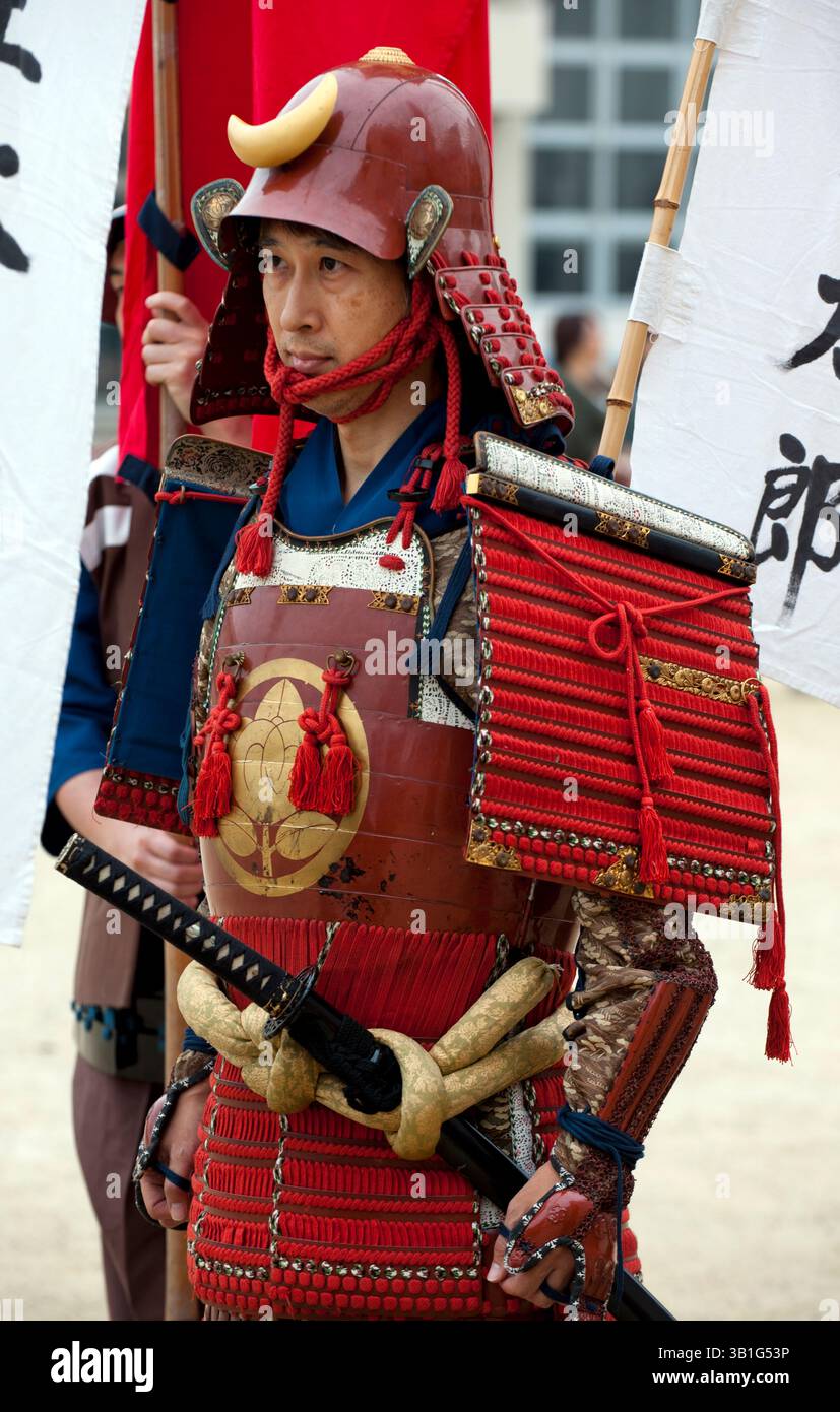Samurai warrior in full armor costume with kabuto helmet participates ...