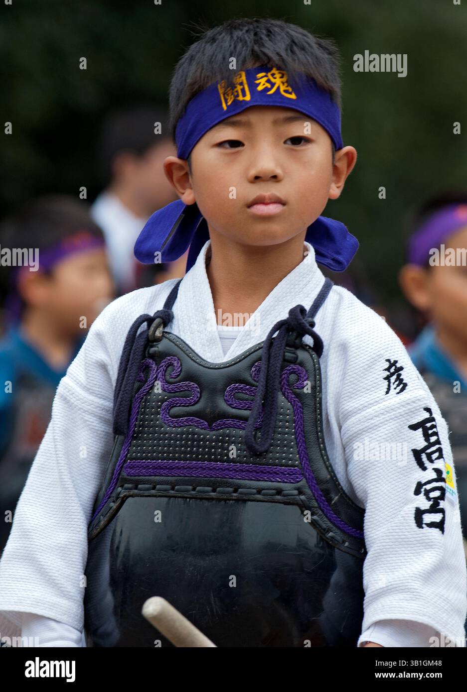 Member of the junior kendo team pretending to be a samurai warrior ...