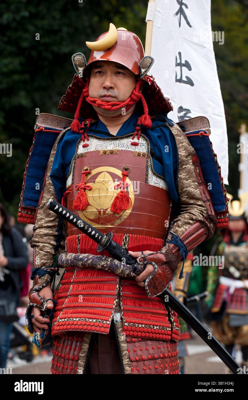 Samurai warrior in full armor costume with kabuto helmet participates ...