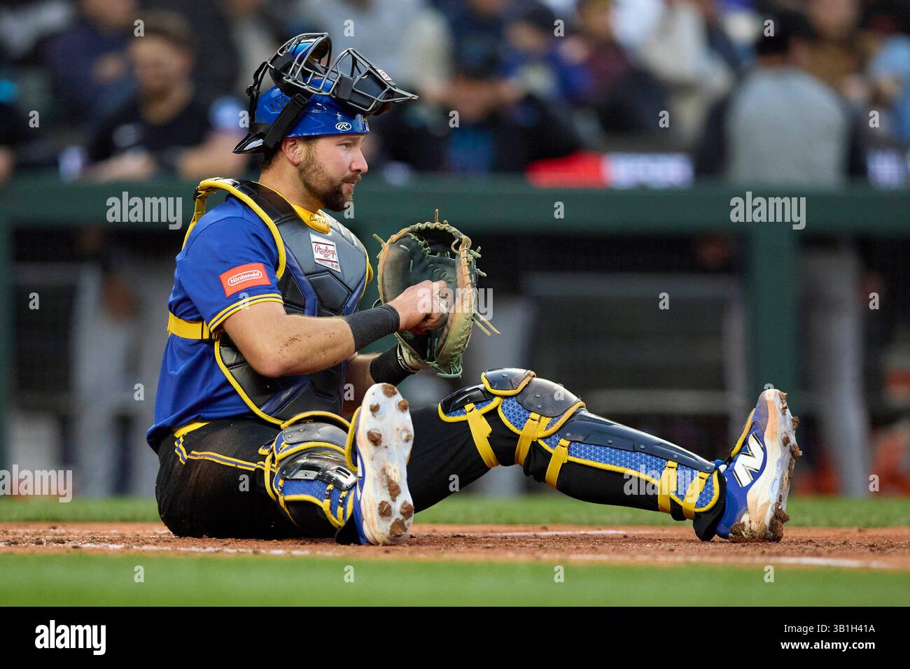 Seattle Mariners catcher Cal Raleigh sits after not making a tag ...