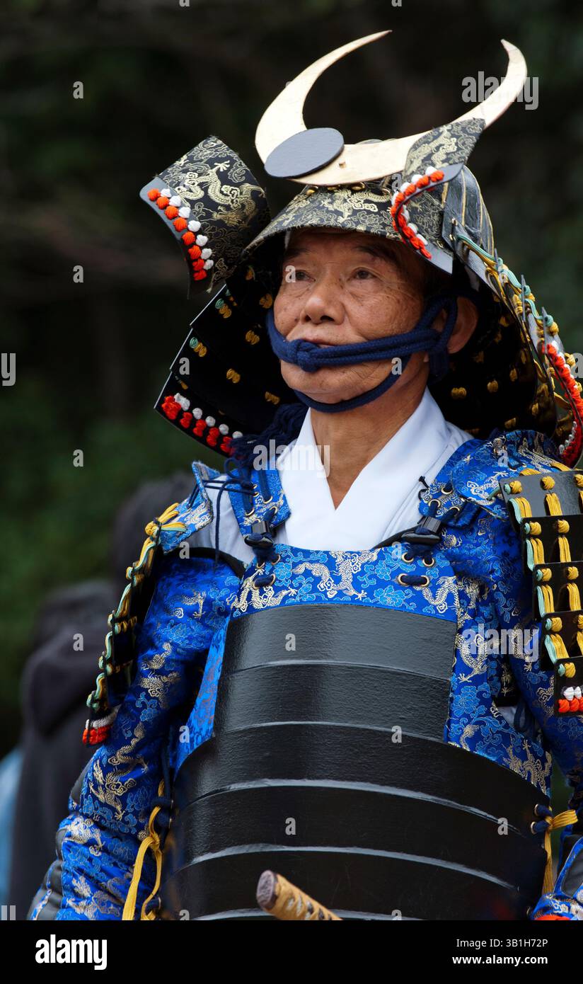 Samurai warrior in full armor costume with kabuto helmet participates ...