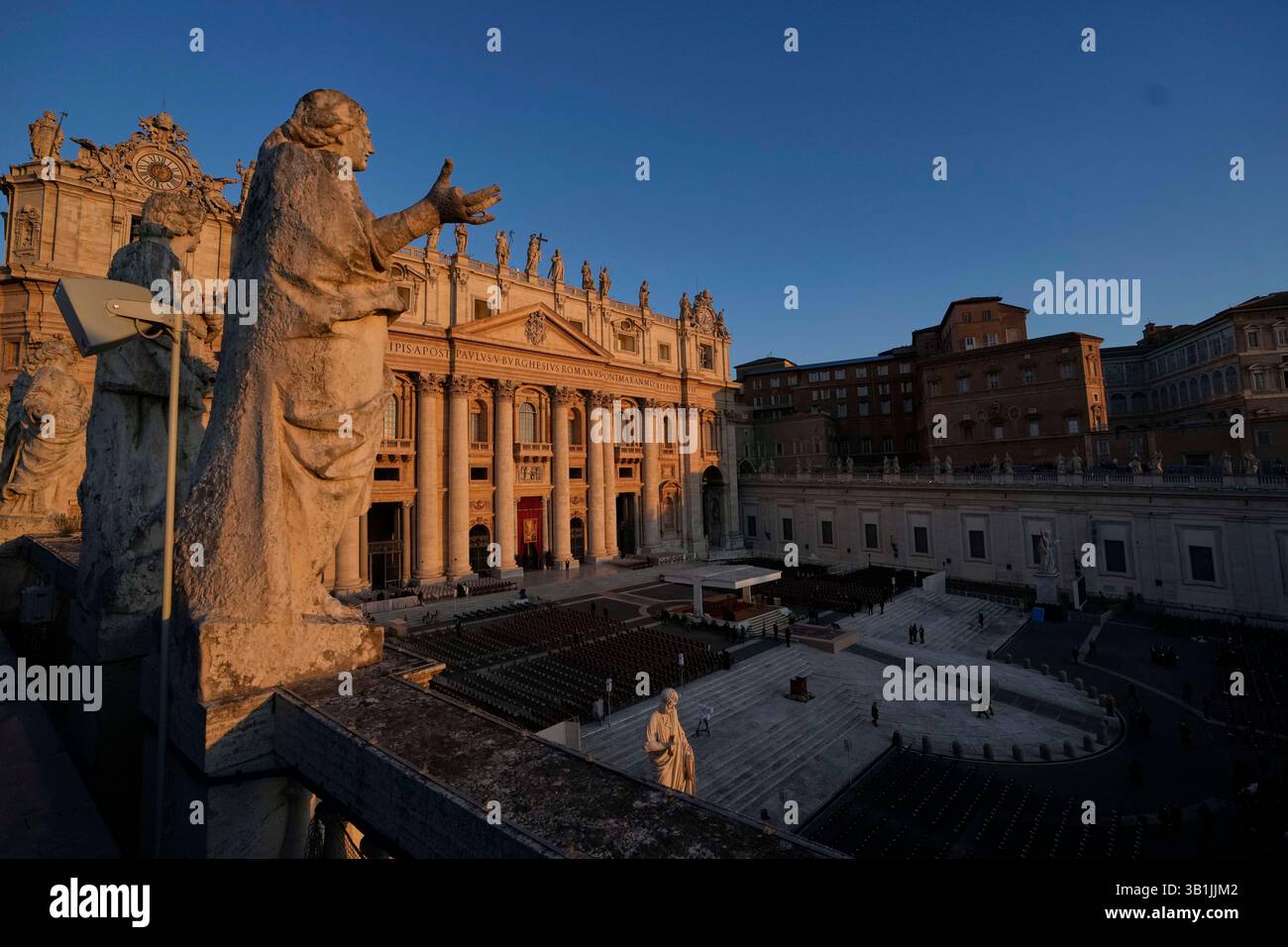 St. Peter's Basilica is bathed in light as the sun rises ahead of the ...