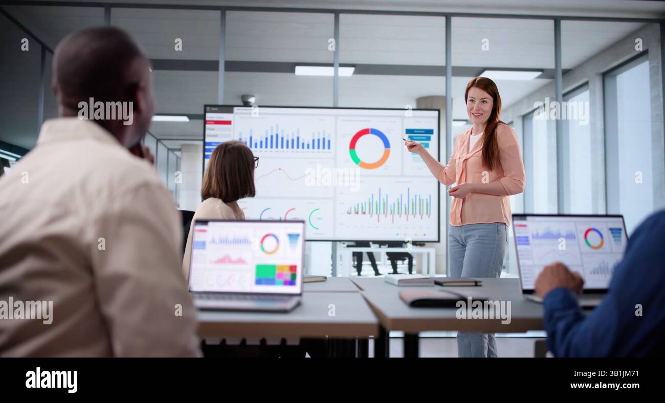 Diverse Group Discusses Financial KPI Data In Boardroom Meeting Stock ...