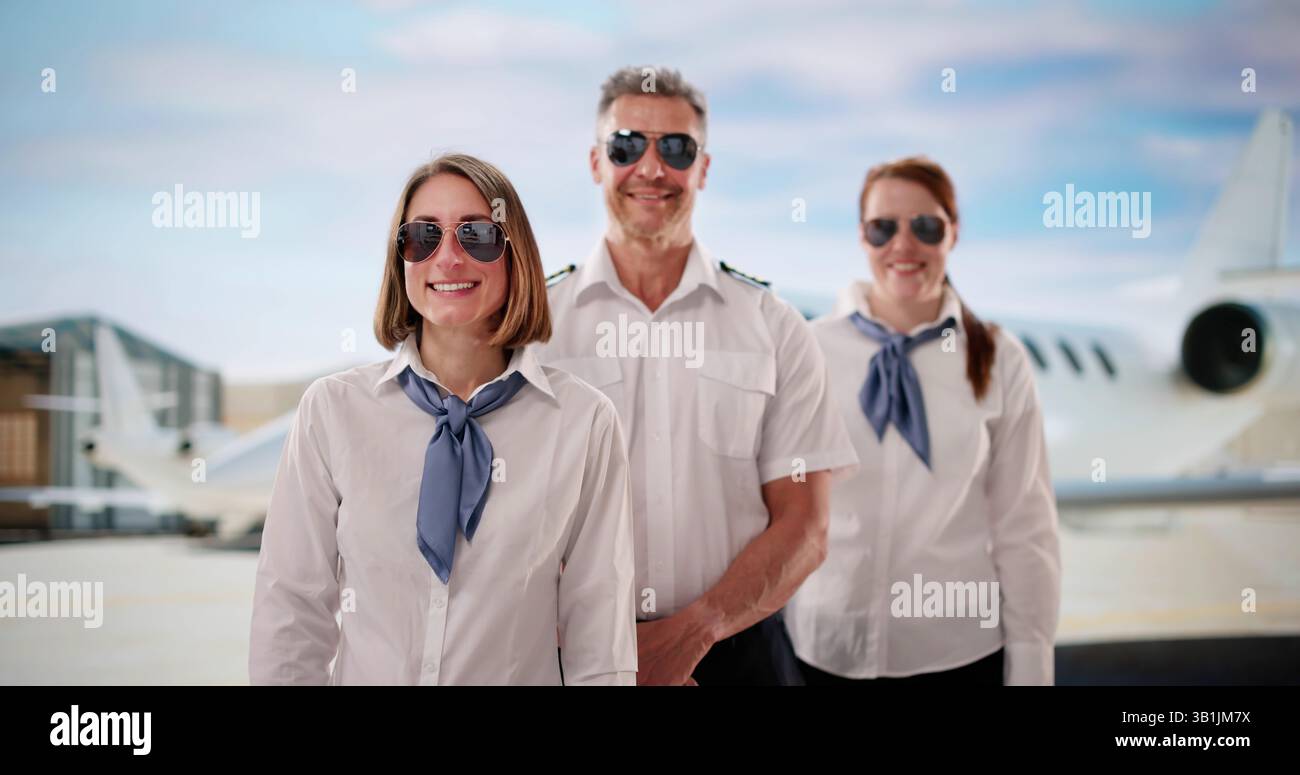 The Flight Attendants And Pilot Of A Private Jet Crew Stock Photo - Alamy
