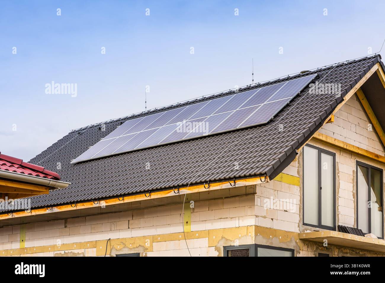 Photovoltaic panels on a roof of family house, solar panels ...