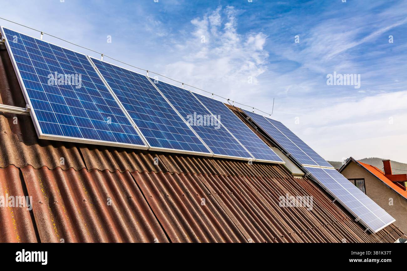 Photovoltaic panels on a roof of family house, solar panels ...