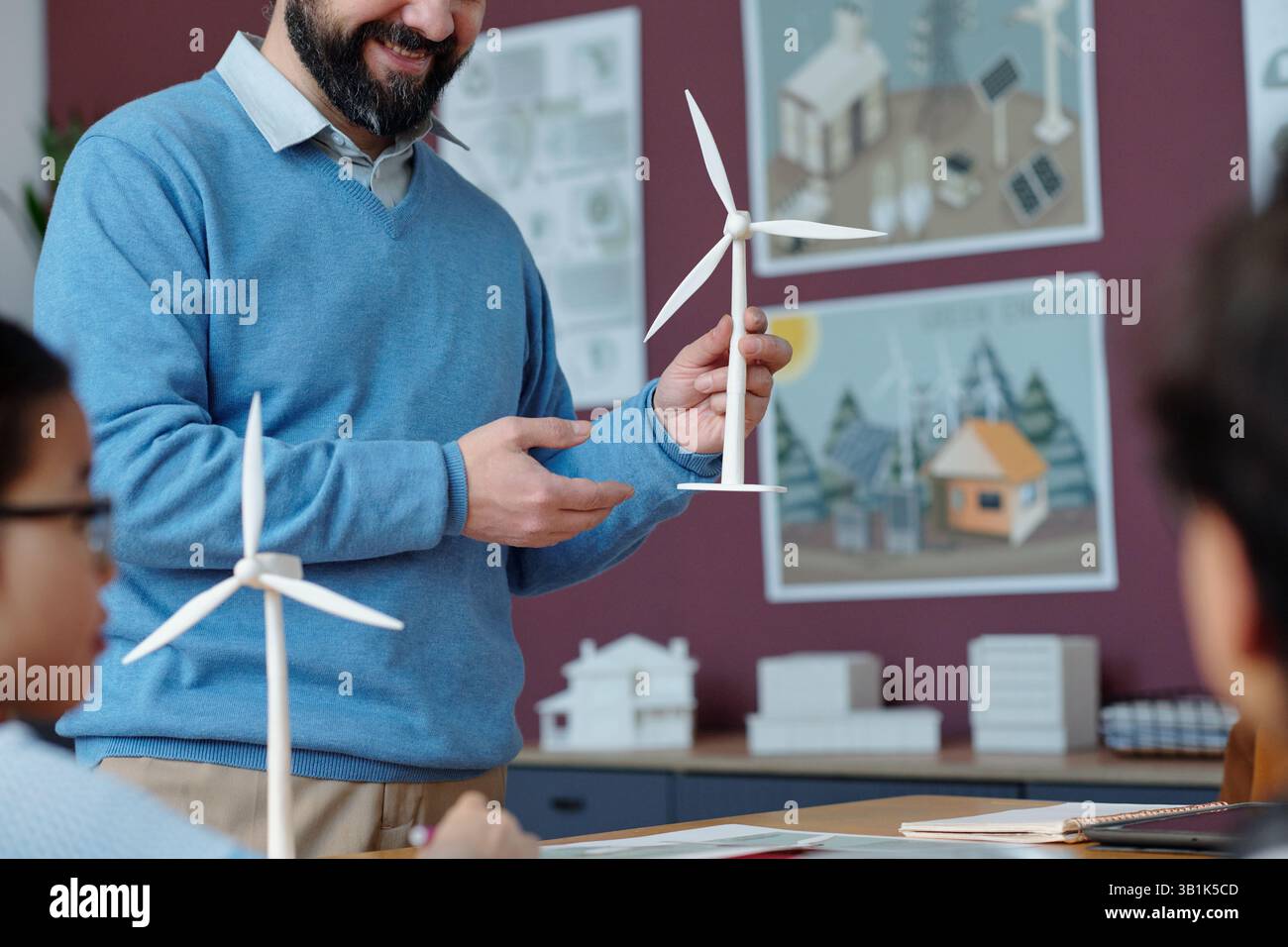 Smiling Teacher Explaining Wind Energy Model in Classroom Stock Photo ...