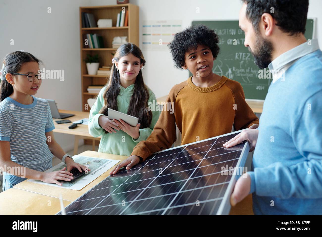 Explaining Solar Panel to Engaged Students in Classroom Stock Photo - Alamy