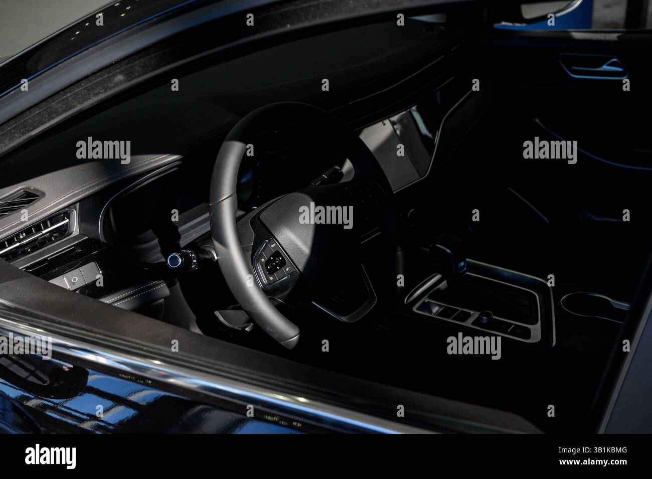 Black leather steering wheel, automatic transmission and modern control ...