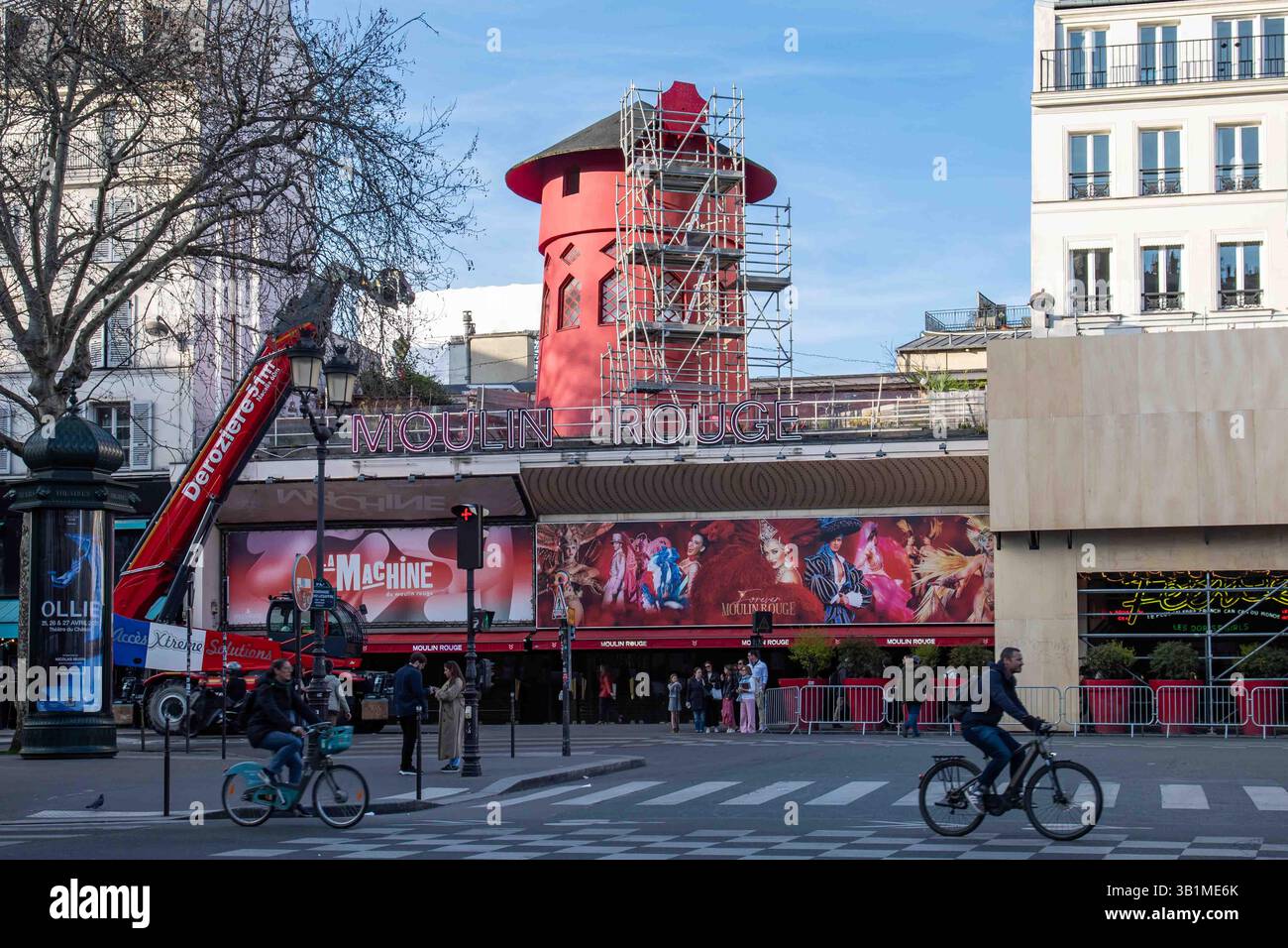 Red windmill of Moulin Rouge under renovation at Place Blanche in Paris ...
