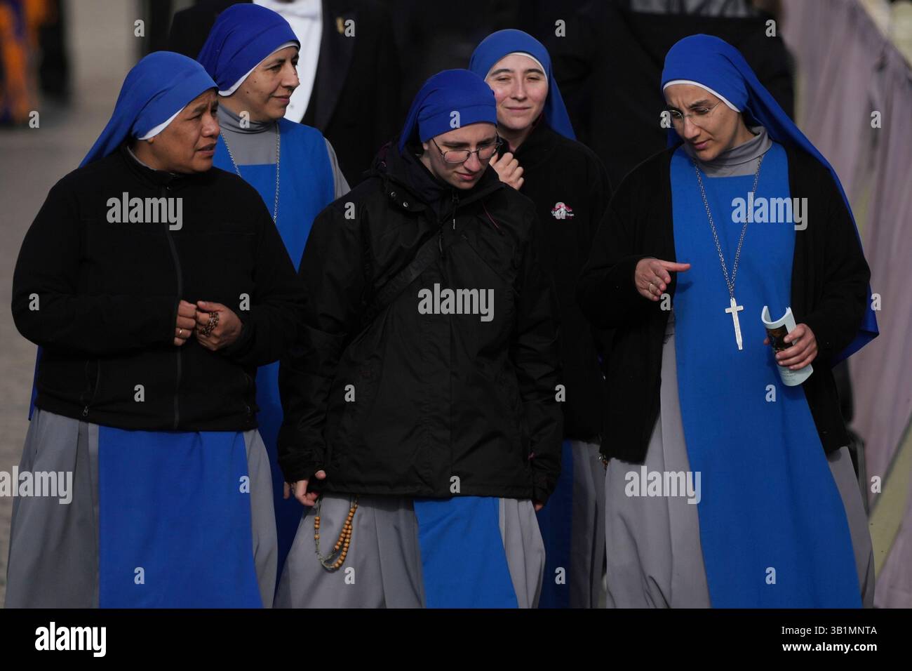 A group of nuns walks outside St Peter's Basilica ahead of the funeral ...