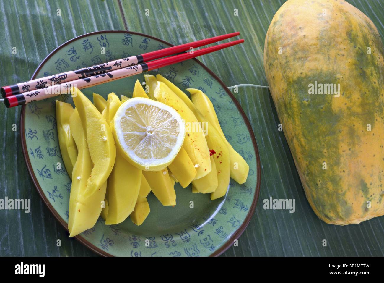 Tropical fruits bananas papaya mango hi-res stock photography and ...