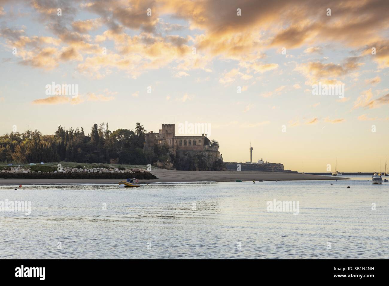 Sunrise on the Atlantic, a castle in the middle of the beach. A ...