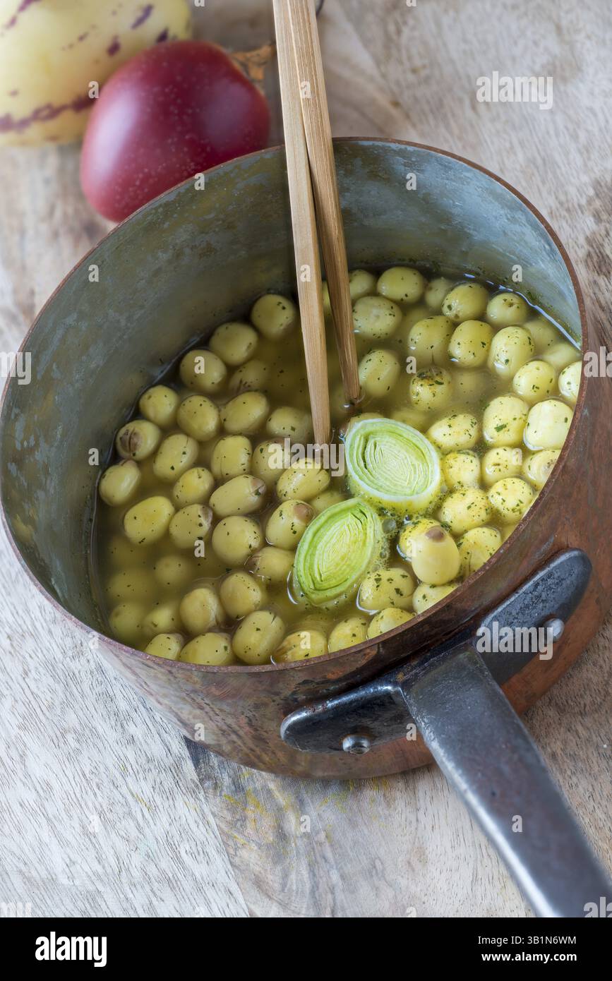 Boiled lotus seeds in vegetable stock Stock Photo - Alamy