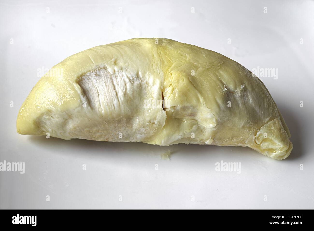Piece of a durian (stinky fruit) . Interior fleshy segment of a durian ...