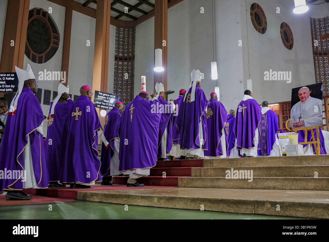 Catholic priests attend a mass for the late Pope Francis at the Holy ...