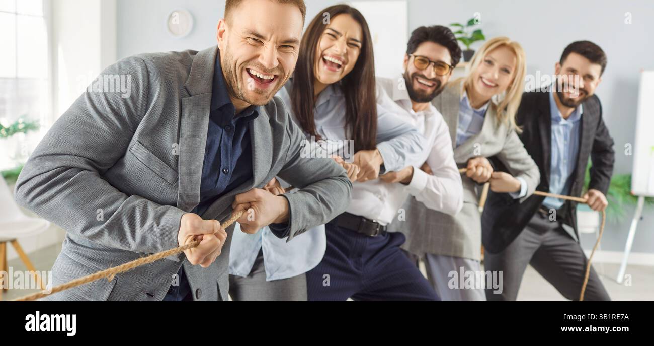 Business team competition office contest, tug of war pulling at ...