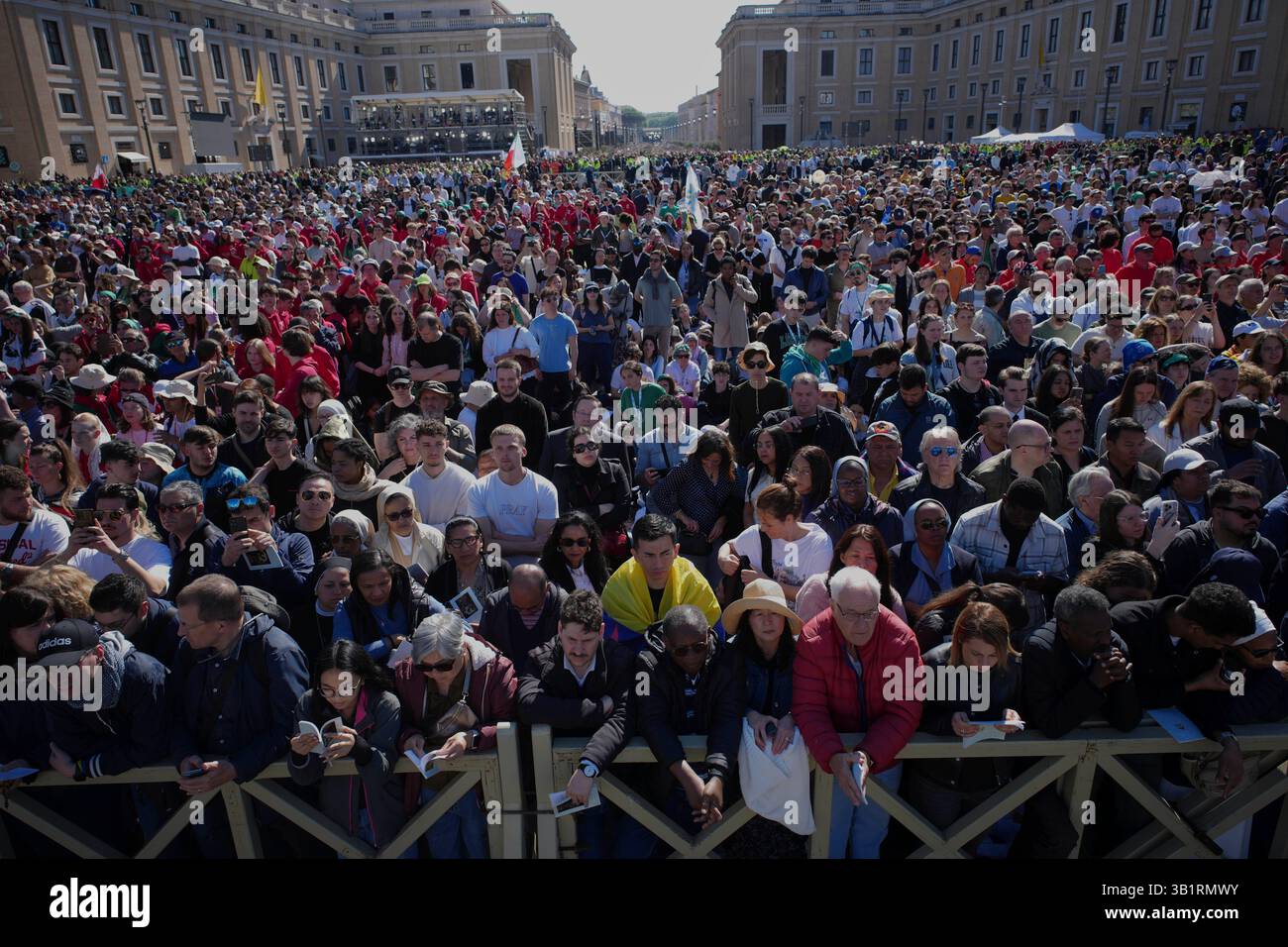 Faithful listen to mass during the funeral of Pope Francis in St. Peter ...