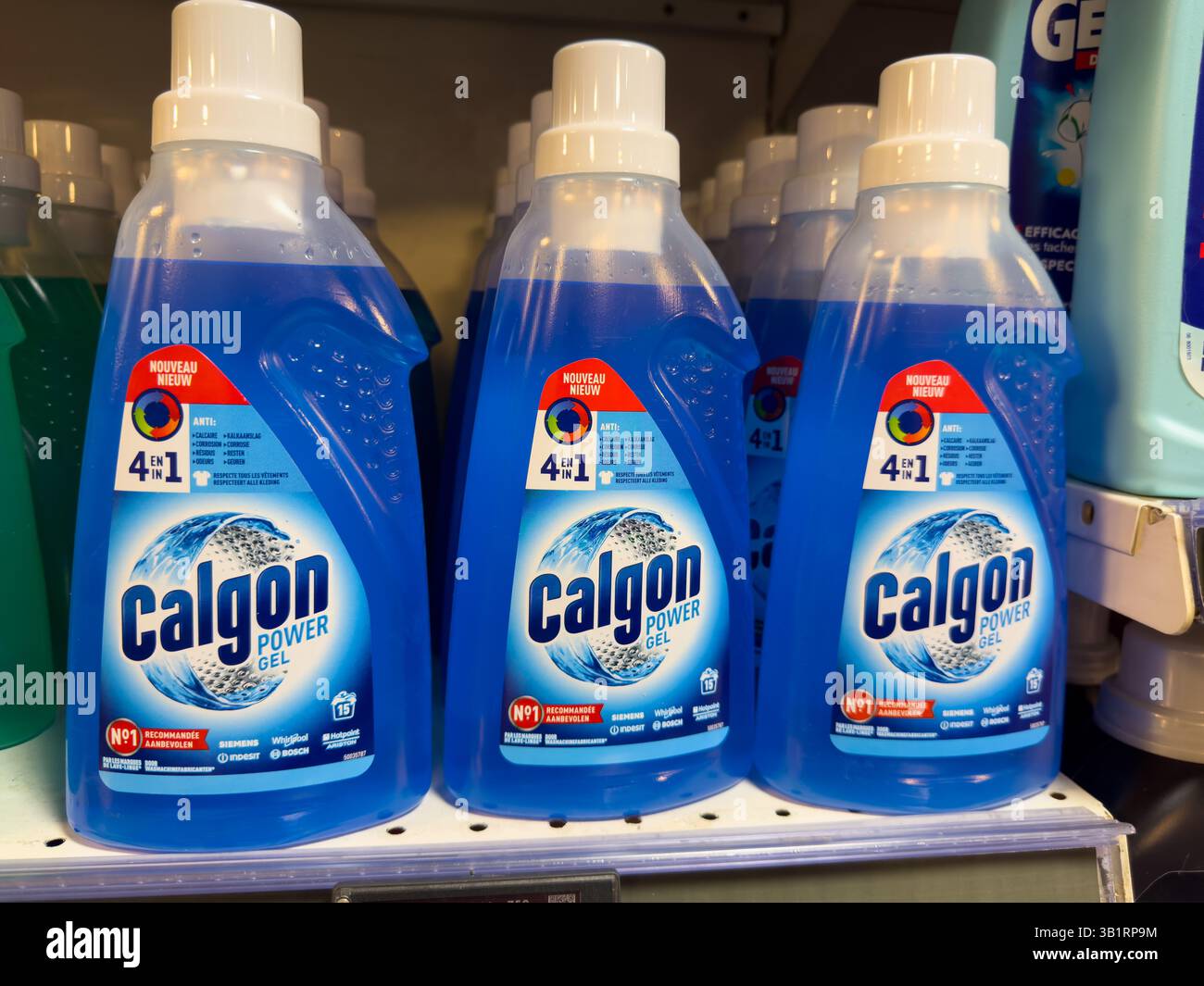 Brightly colored detergent bottles line a shelf, showcasing a vibrant ...