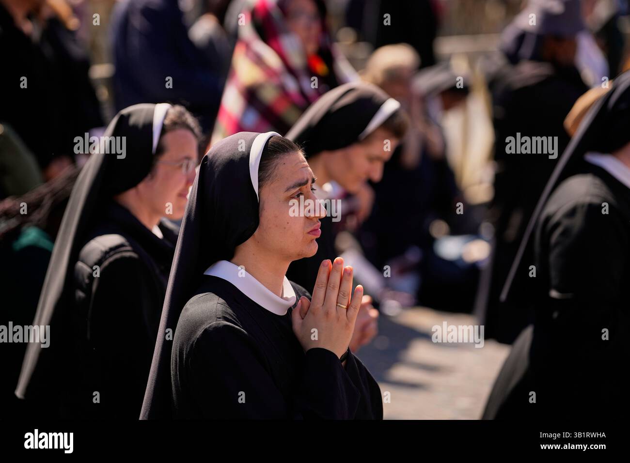 Nuns attend the funeral of Pope Francis in St. Peter's Square at the ...