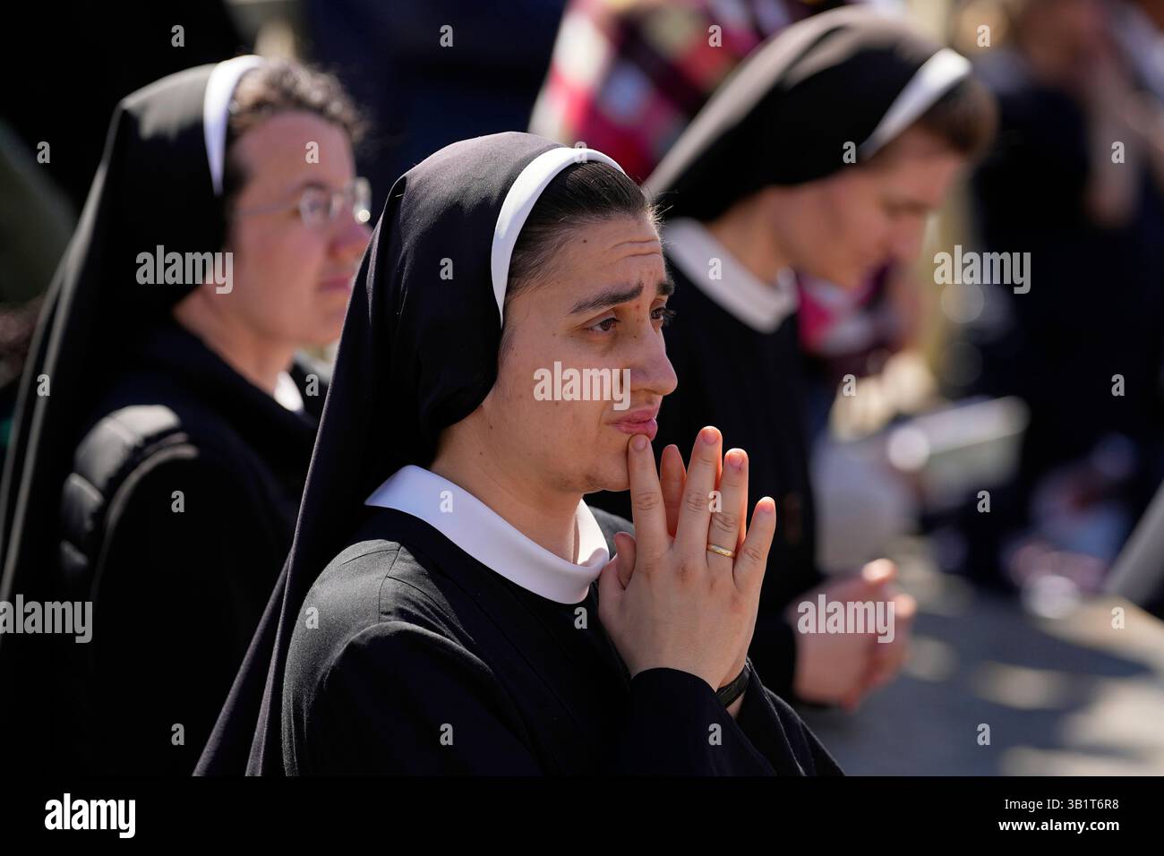 Nuns attend the funeral of Pope Francis in St. Peter's Square at the ...