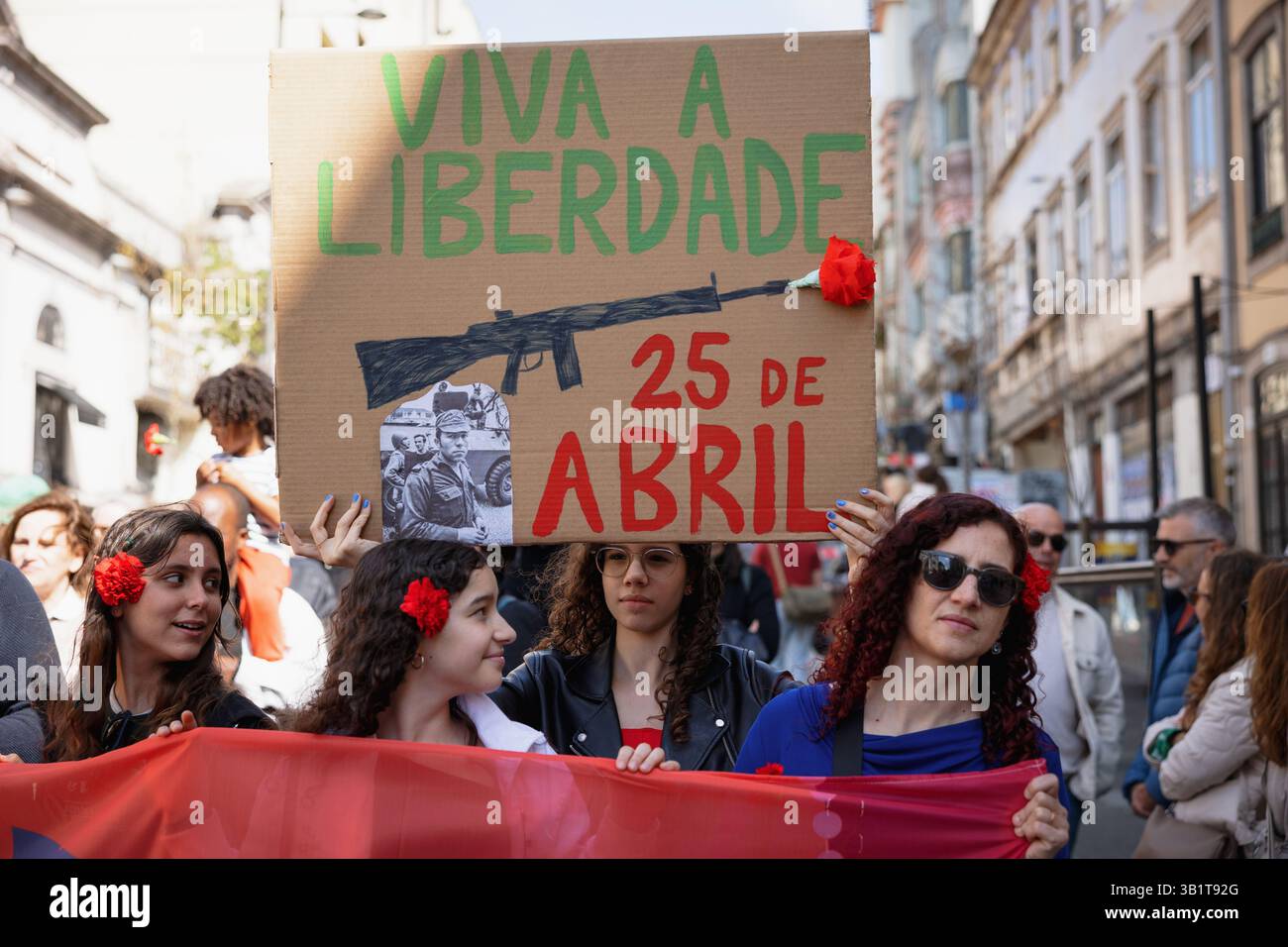 Porto, Portugal. 25th Apr, 2025. A young woman, in the background ...