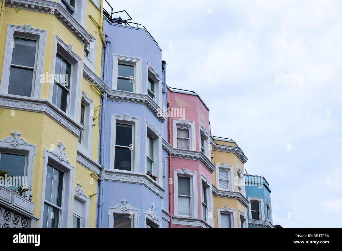 Yellow, pink and blue pastel buildings in Notting Hill, London Stock ...